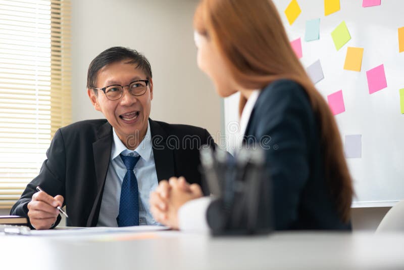 Business Partnership Concept, Senior in Business is Explaining and ...