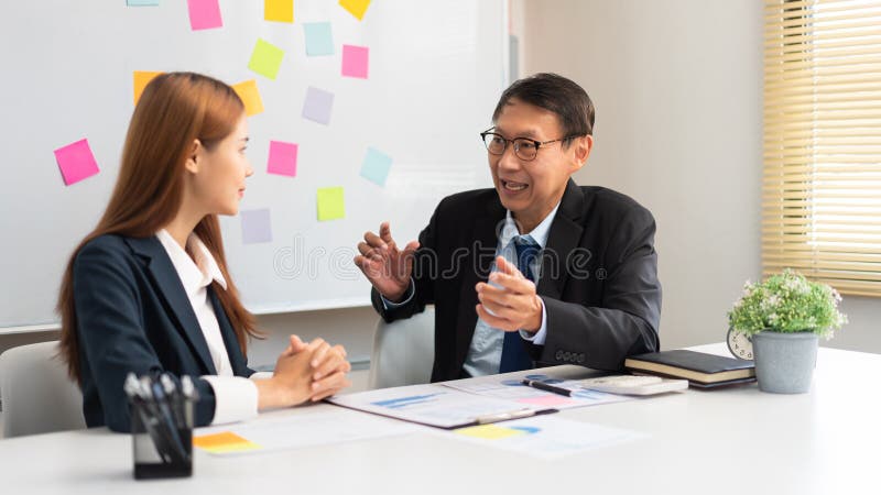 Business Partnership Concept, Senior in Business is Explaining and ...