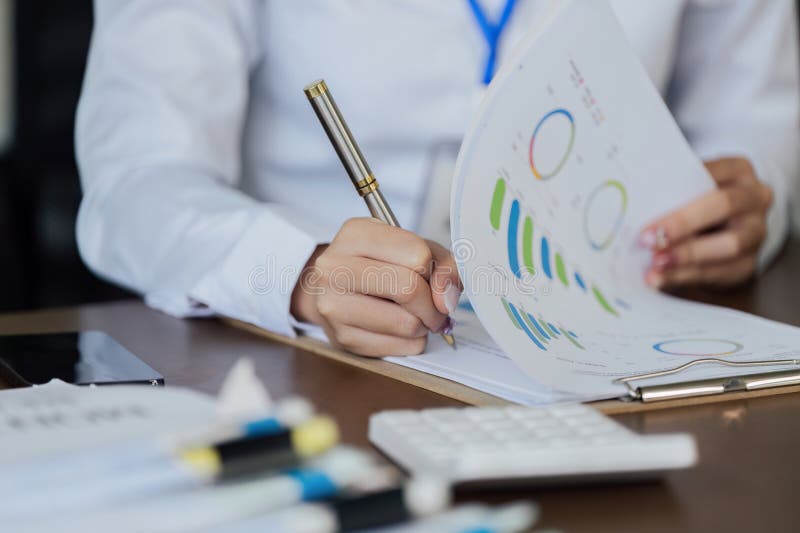 Business People or Accountants are Analyzing Graphs on Finance ...