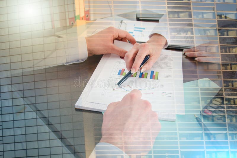 Business People Analyzing a Chart; Multiple Exposure Stock Image ...