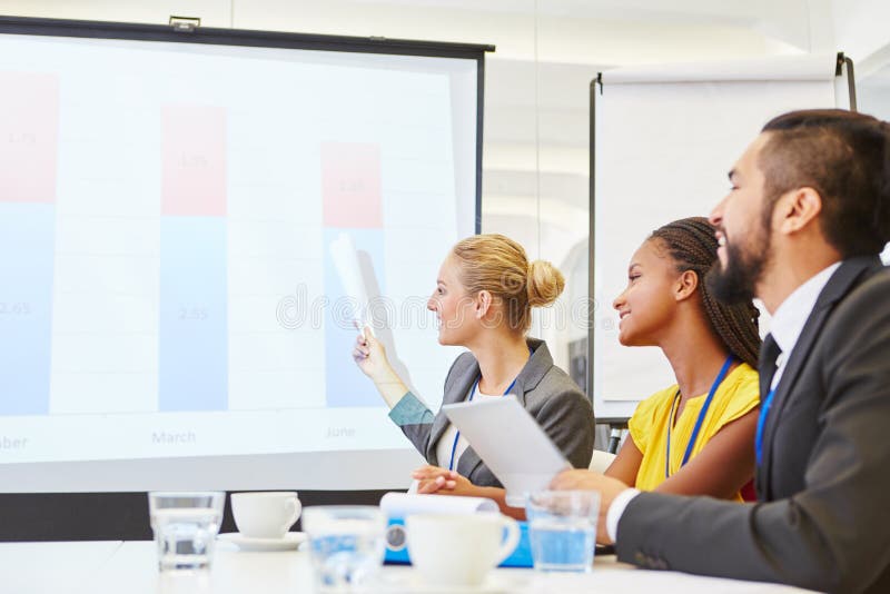Business People Analyzing Graphic with Statistics Chart Stock Image ...