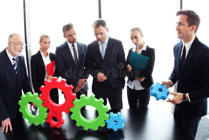 Business People Assembling Cogwheels Stock Photo - Image of structure ...