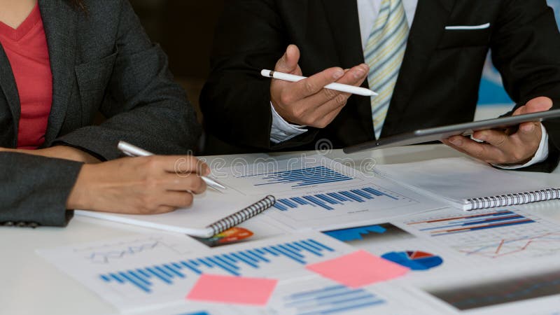 Business People Calculate, Analyze, Graph, Financial in the Office ...