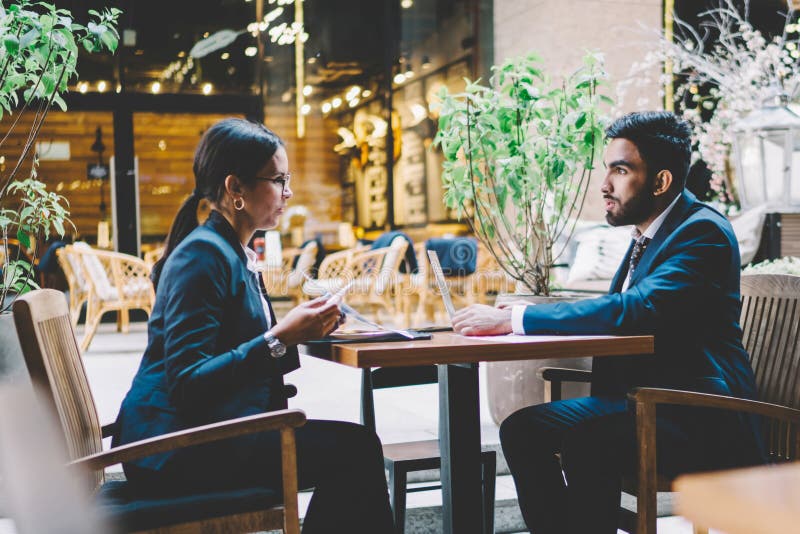 Business People Chatting with Each Other in Cafe Stock Image - Image of ...