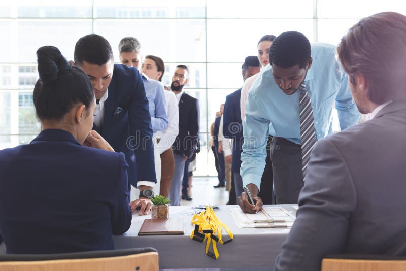 Business People Checking in at Conference Registration Table Stock ...