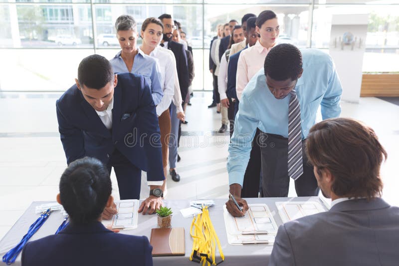Business People Checking in at Conference Registration Table Stock ...