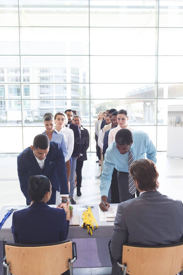 Business People Checking in at Conference Registration Table Stock ...