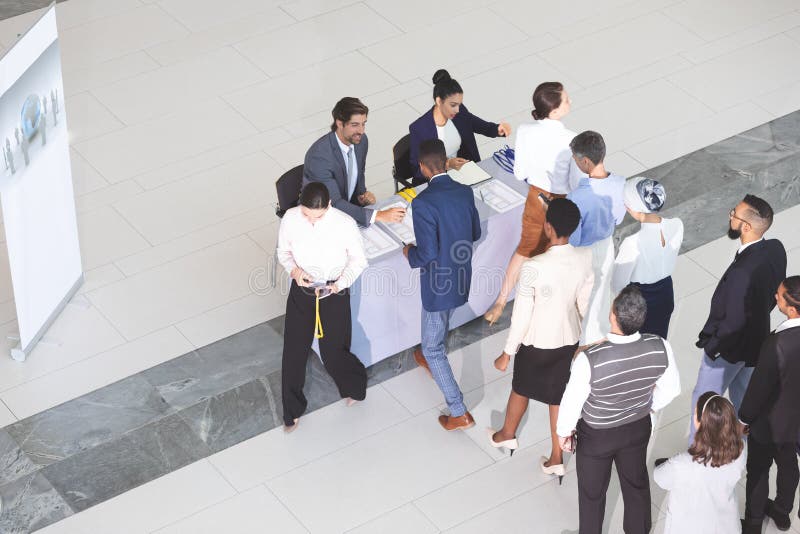Business People Checking in at Conference Registration Table Stock ...