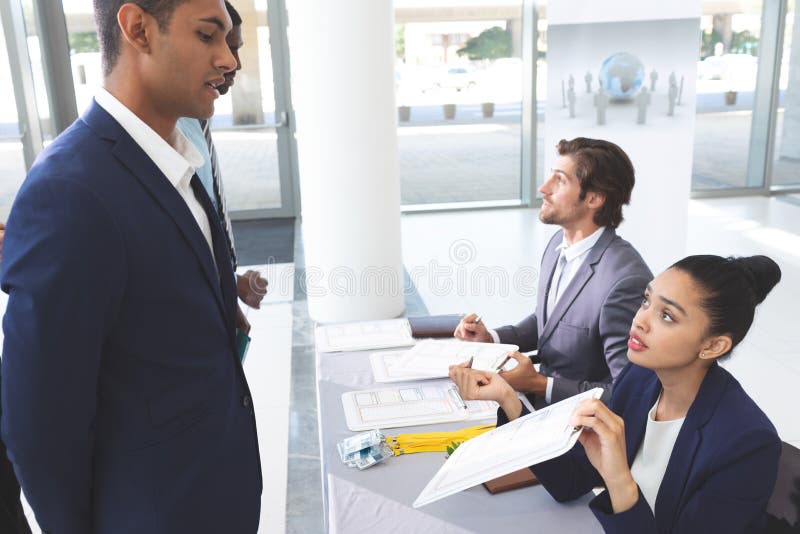 Business People Checking in at Conference Registration Table Stock ...