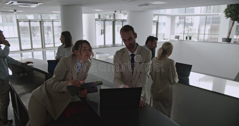 Business Professionals Collaborate in a Modern Open Office Space ...