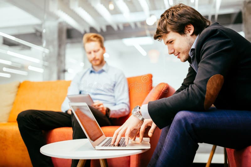 Business People Collaborating in Office and Working on Project Together ...