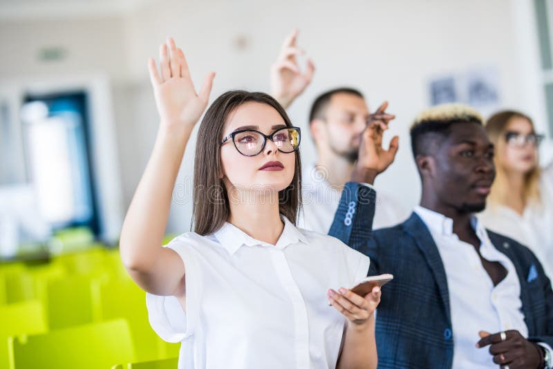 Business People at the Conference Raising Hands To Answer a Question ...