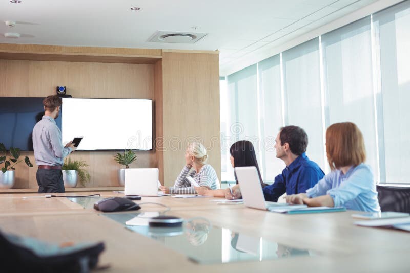 Business People at Conference Table in Office Stock Photo - Image of ...