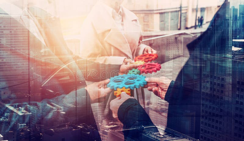 Business Team Work Together and Combine Pieces of Gears. Partnership ... Business Team Work Together and Combine Pieces of Gears. Partnership ...