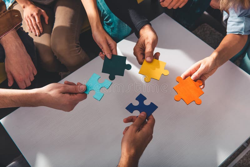 Teamwork of Partners Connect Puzzle Pieces As Integration and Startup ...