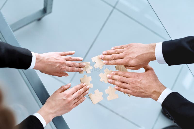 Business People Connecting Puzzle Pieces. Close Up. Stock Photo - Image ...