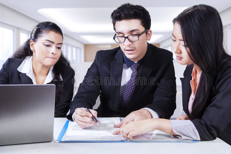 Business People with a Contract Document Stock Image - Image of ...