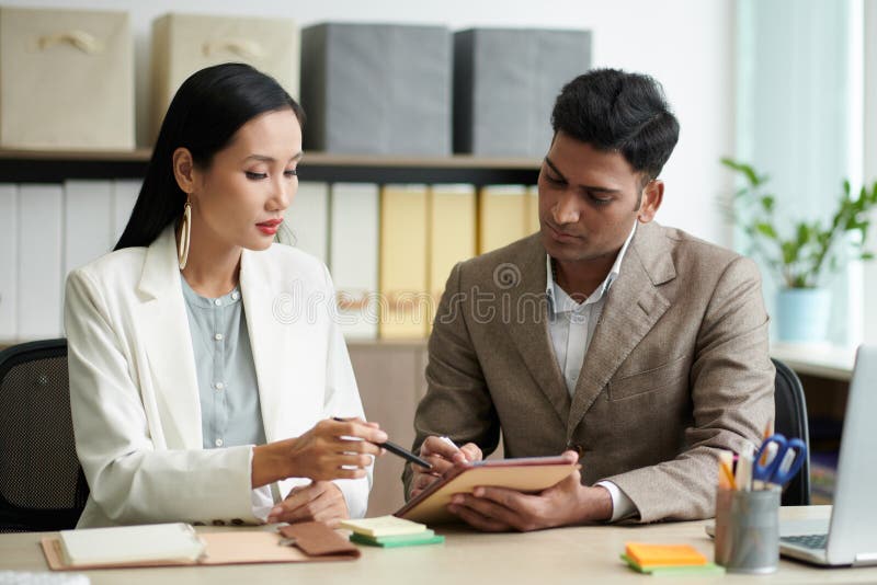 Business People Correcting Document Stock Photo - Image of talking ...