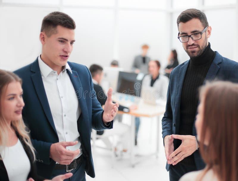Business People Discuss Something Standing in the Office Stock Photo ...