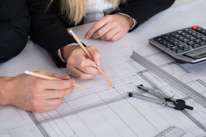 Business People Discussing a Architectural Drawing Stock Image - Image ...