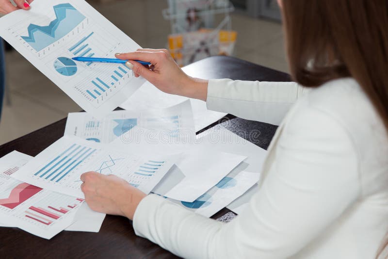 Business People Discussing the Charts and Graphs Showing the Results of ...