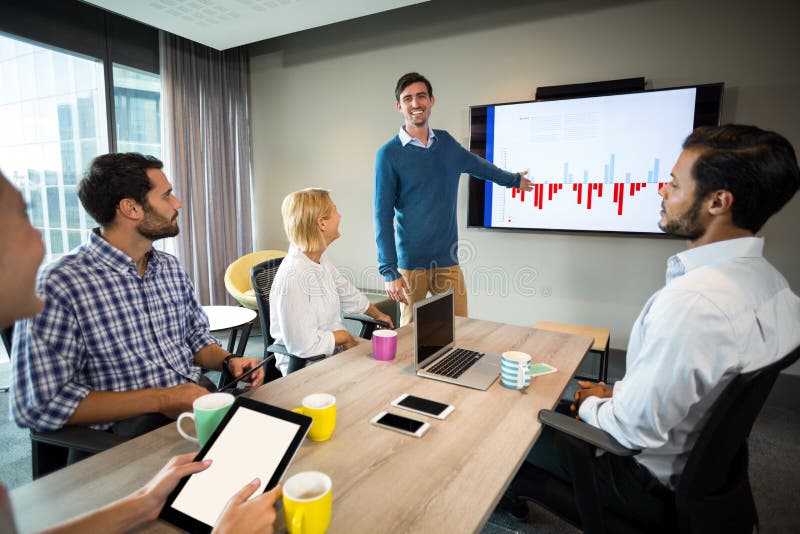 Business People Discussing Over Graph during a Meeting Stock Image ...