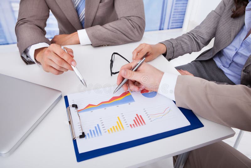 Business People Discussing Over Graph in Office Stock Image - Image of ...
