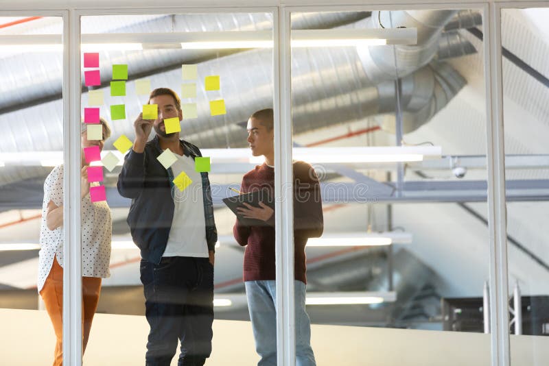 Business People Discussing Over Sticky Notes in the Office Stock Photo ...