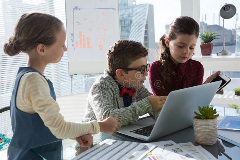 Business People Discussing Over Technology at Desk Stock Photo - Image ...