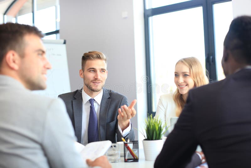 Business People in Discussing Something while Sitting Together at the ...