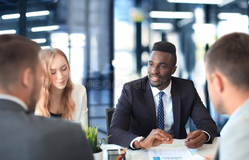 Business People in Discussing Something while Sitting Together at the ...