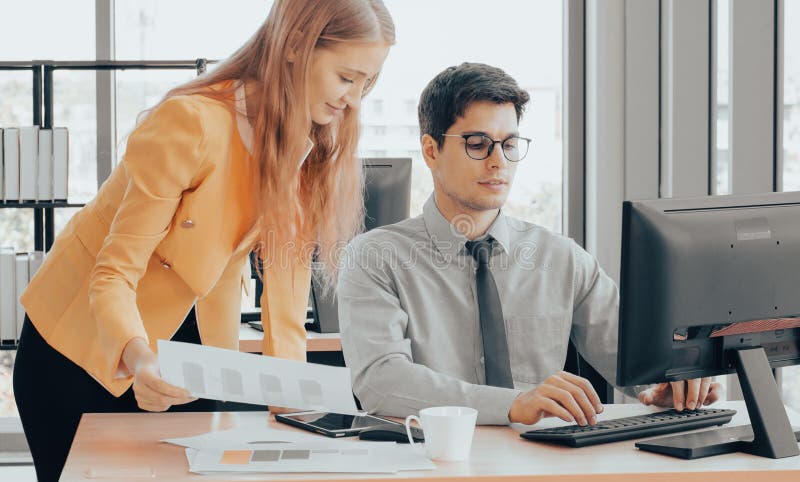 Business People Discussing Statistics in Documents and Information on ...