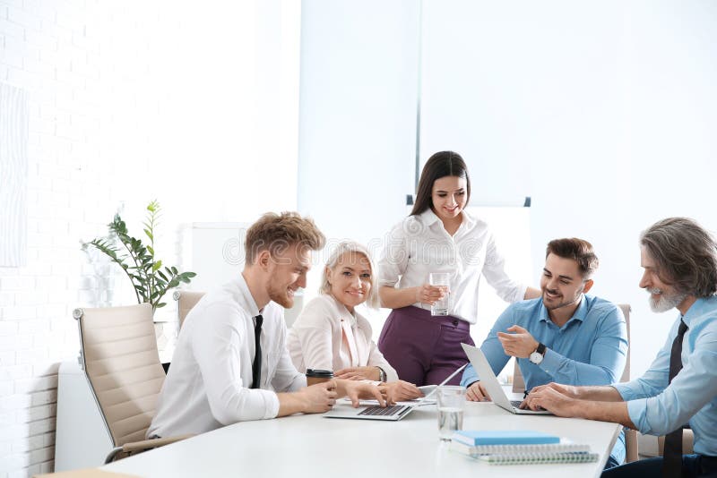 Business People Discussing Work Matters in Office Stock Photo - Image ...