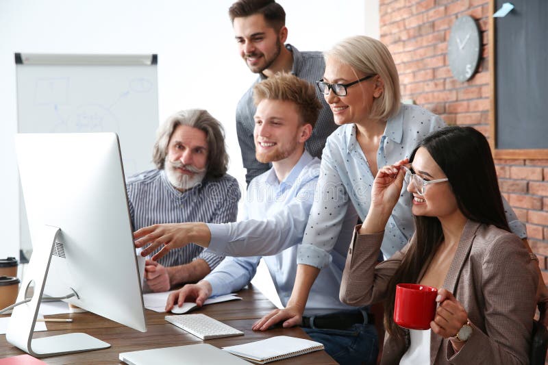 Business People Discussing Work Matters at Table in Office Stock Image ...