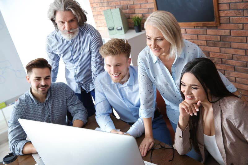 Business People Discussing Work Matters at Table in Office Stock Image ...