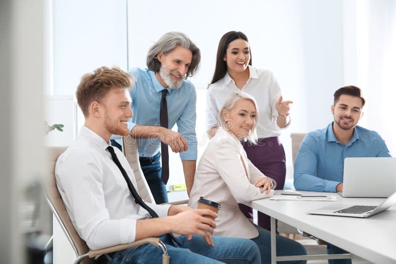 Business People Discussing Work Matters at Table in Office Stock Photo ...