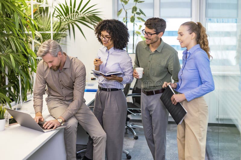 Business People Discussing Work Together Using a Tablet and Laptop ...