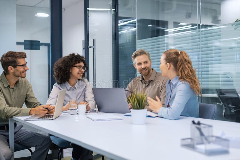 Business People Discussing Work Together Using a Tablet and Laptop ...