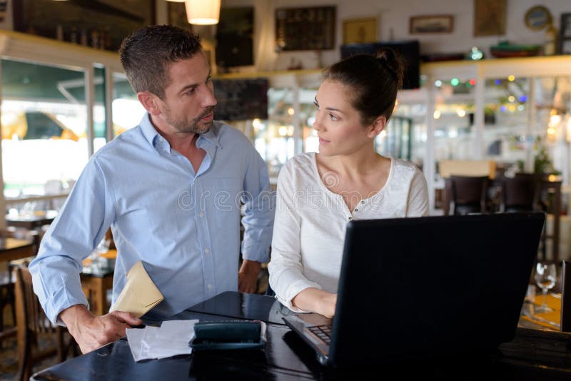 Business People in Discussion in Bar Stock Image - Image of ...