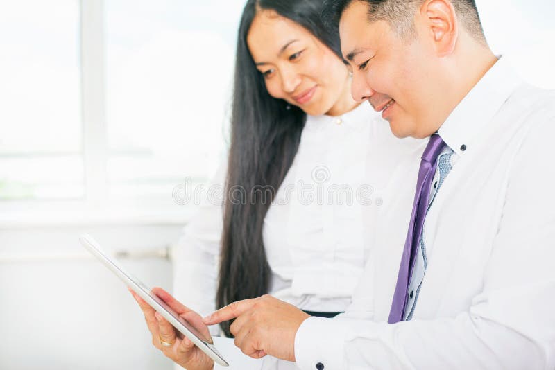 Business People Dressed in White Using Tablet Pc at Office Stock Image ...