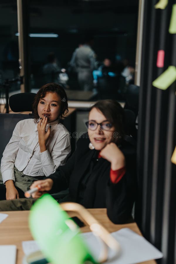 Business People Engaged in a Late Night Office Work Session Stock Photo ...