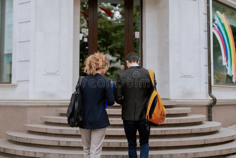 Business People Entering Modern Office Building in the Morning Stock ...
