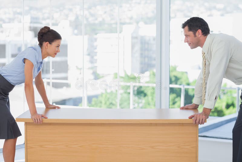 Business People Facing Off at Desk Stock Image - Image of partnership ...