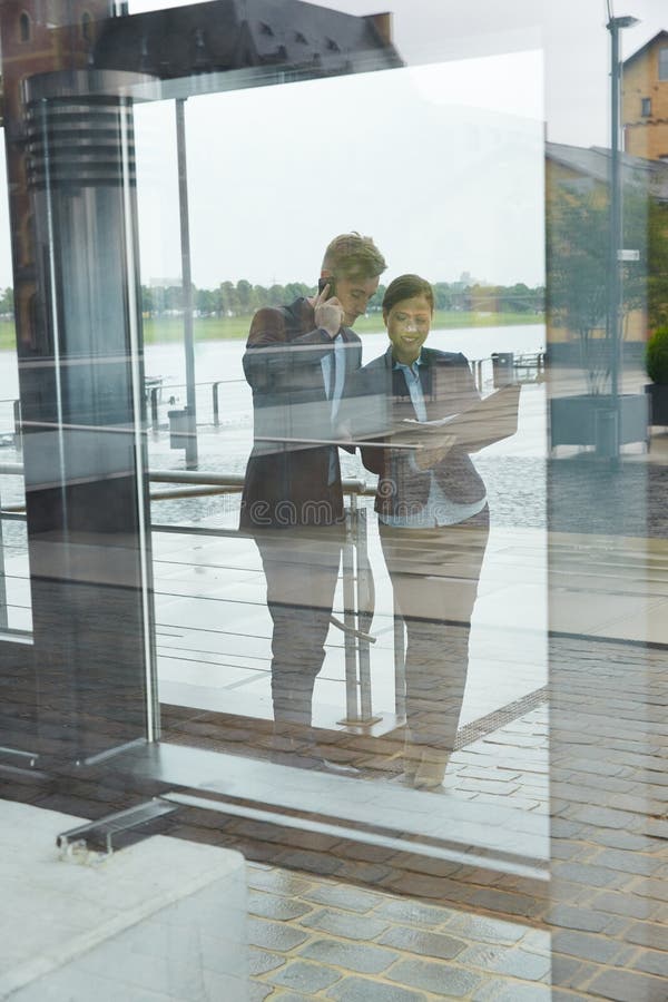 Business People with Files Behind Stock Photo - Image of businesswoman ...