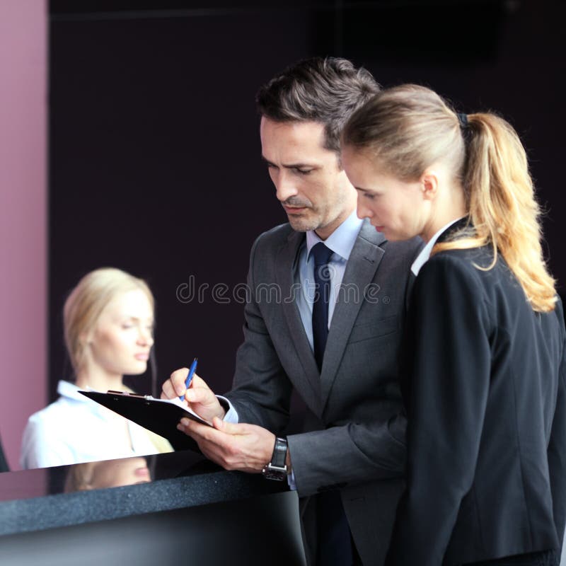 Business People Filling Forms Stock Image - Image of receptionist, desk ...