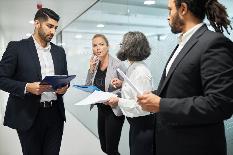 Business People Frantically on the Phone and Discussing Stock Photo ...