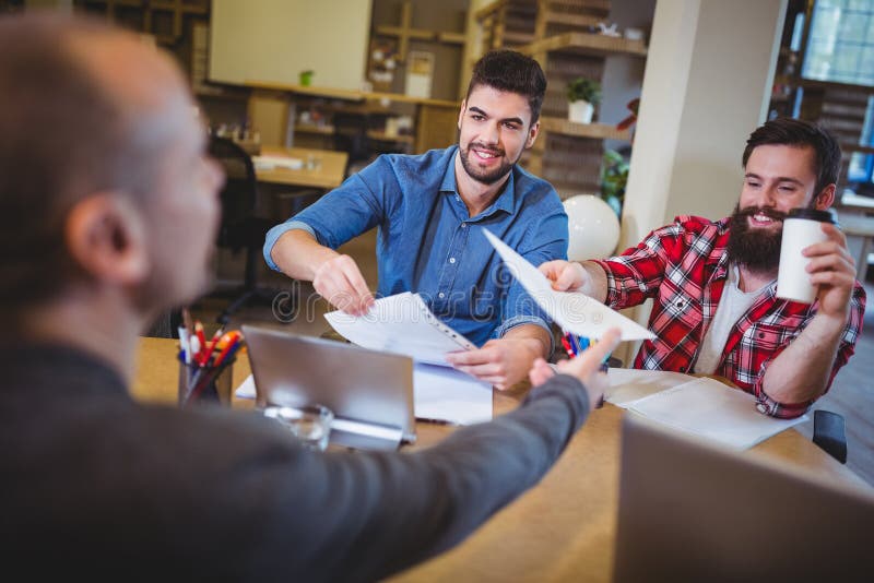 Business People Giving Documents To Colleague Stock Image - Image of ...