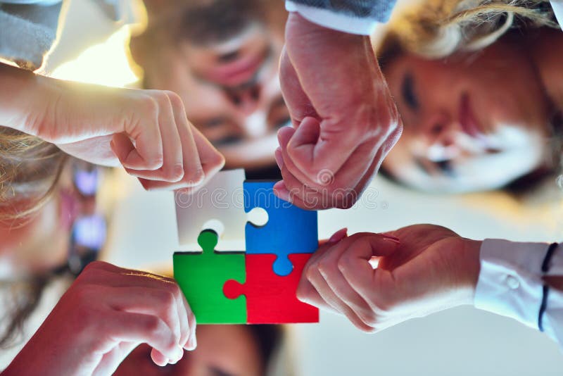 Business People Group Assembling Jigsaw Puzzle and Represent Team ...