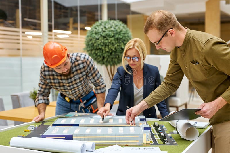 Business People Group on Meeting and Presentation of Building Project ...