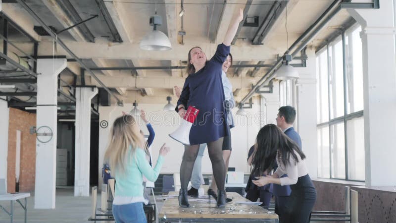 Business People Have Fun Dancing on the Table in the Office Singing in ...